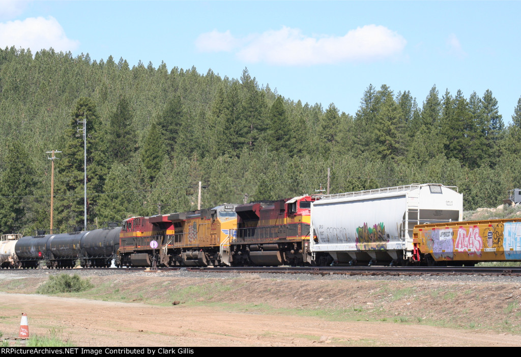 Not the normal mid-train power on the hill. 2 KCS units sandwiching a UP unit.
